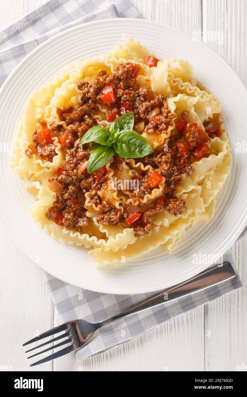 Italian Reginette pasta with bolognese sauce closeup on the plate on ...