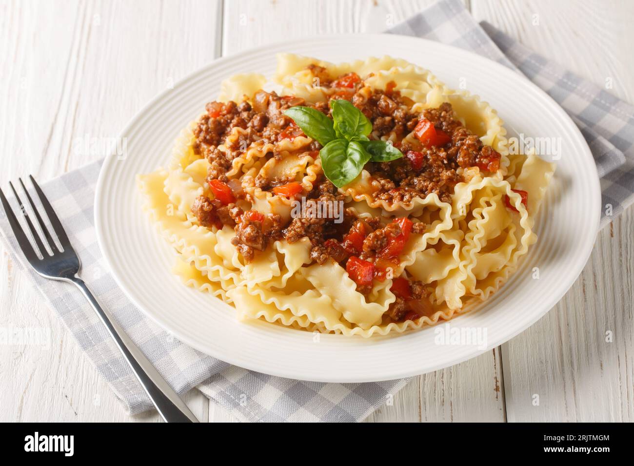 Mafalde or Mafalda or Mafaldine Pasta Bolognese closeup on the plate on ...