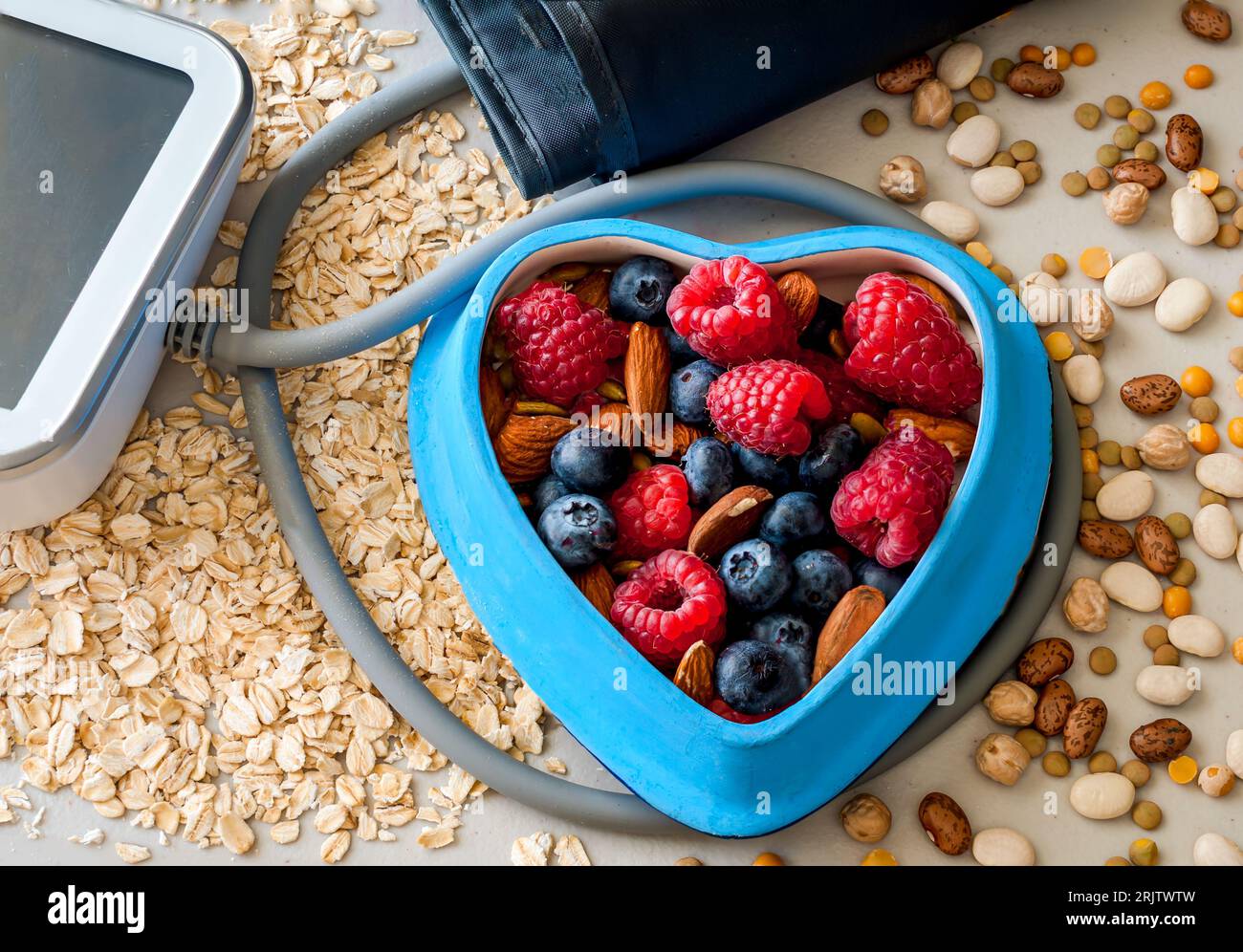 Heart shaped bowl with berries and nuts, close up Stock Photo - Alamy