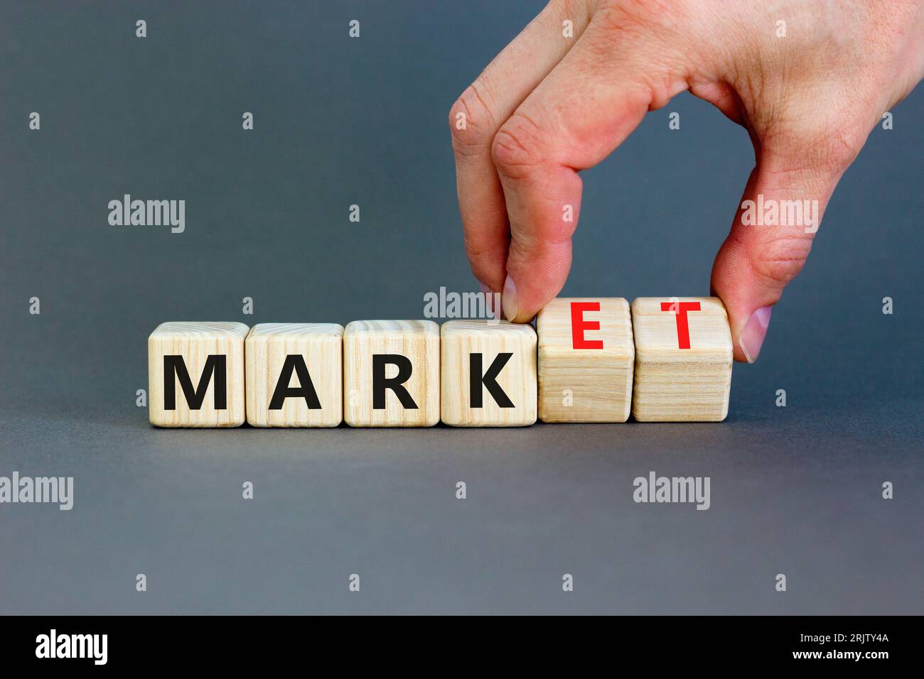 Mark of market symbol. Businessman turns wooden cubes and changes word ...