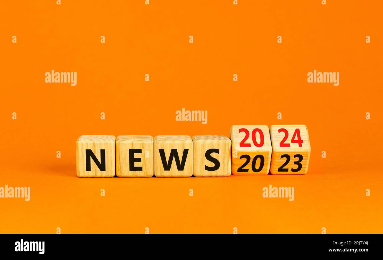 2024 News new year symbol. Businessman turns a wooden cube and changes ...