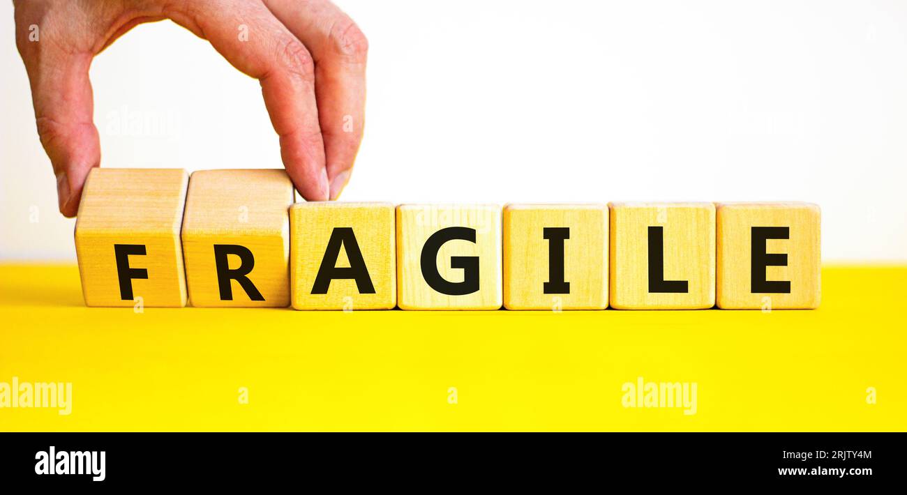 Agile or fragile symbol. Concept words Agile and Fragile on wooden ...