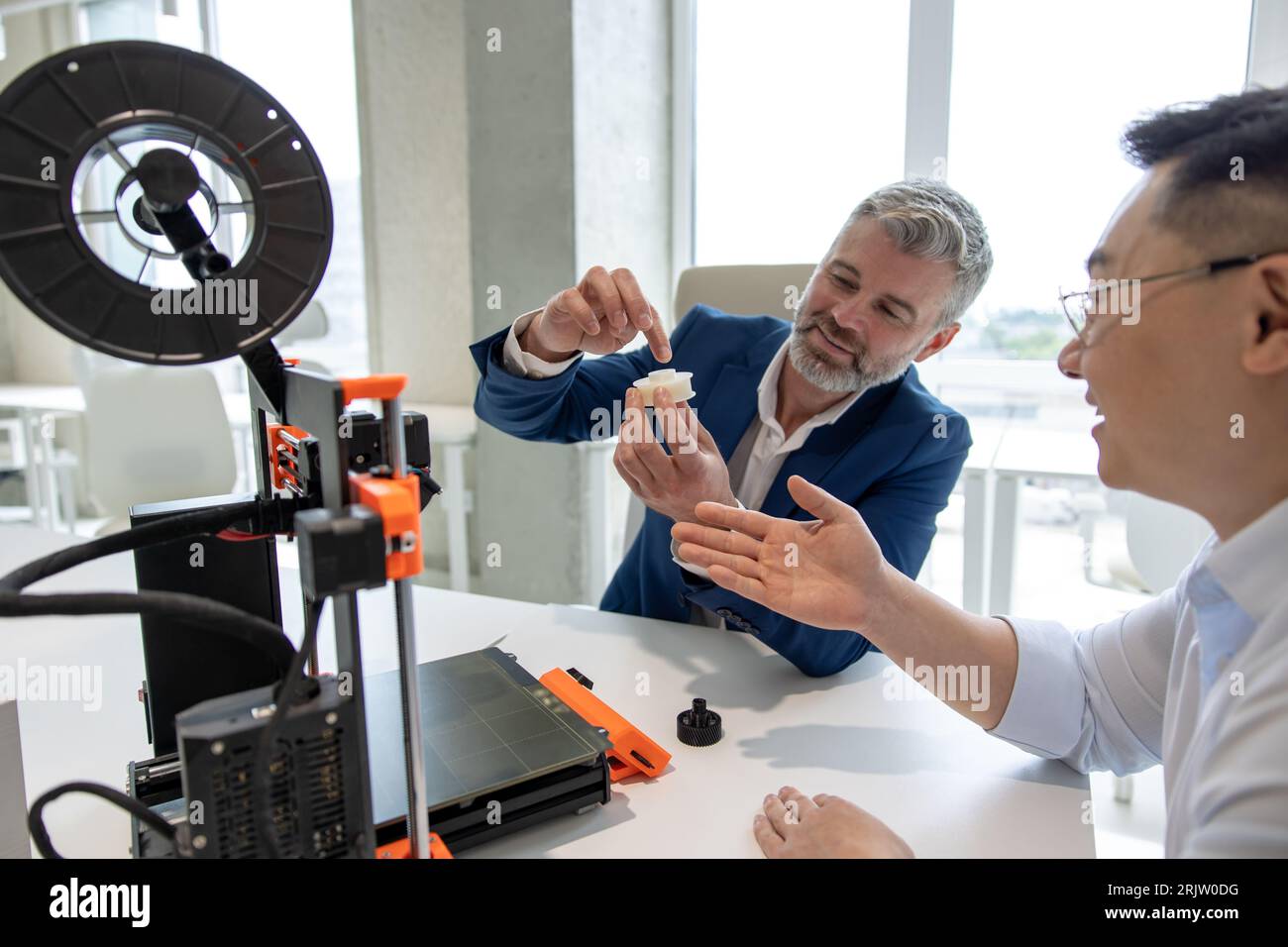 Innovative industrial engineers using 3D printer to build complex ...