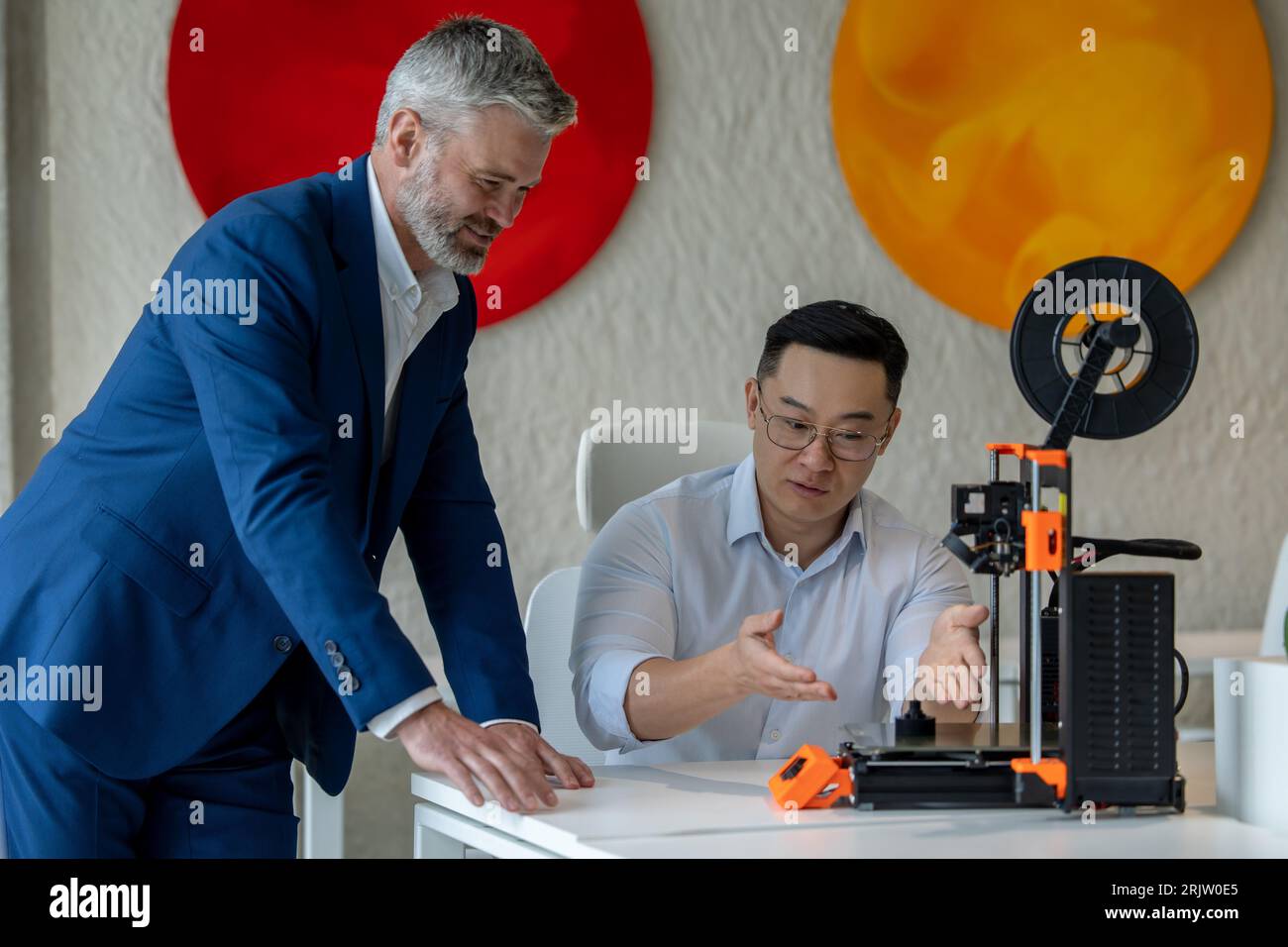 Innovative industrial engineers using 3D printer to build complex ...