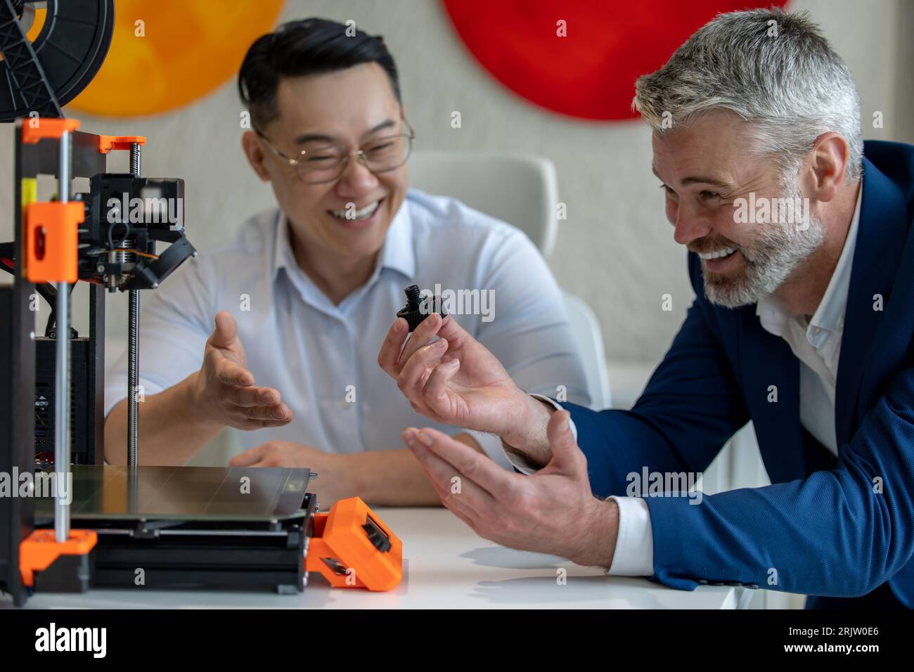 Innovative industrial engineers using 3D printer to build complex ...