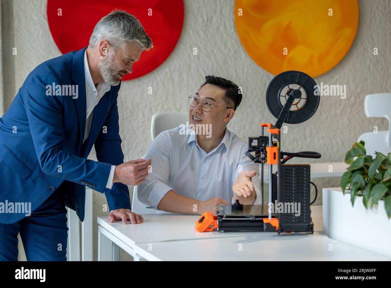 Innovative industrial engineers using 3D printer to build complex ...