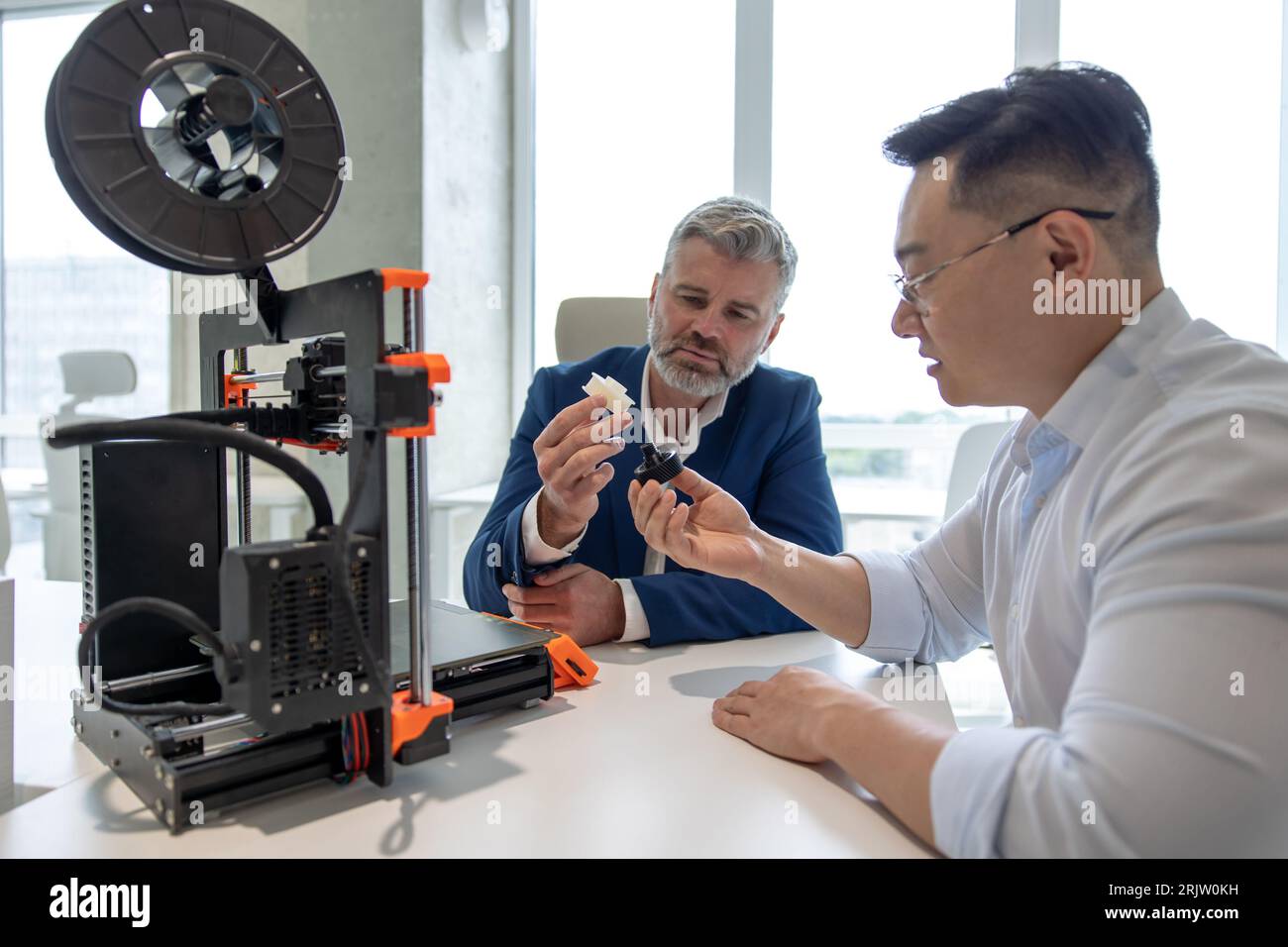 Innovative industrial engineers using 3D printer to build complex ...