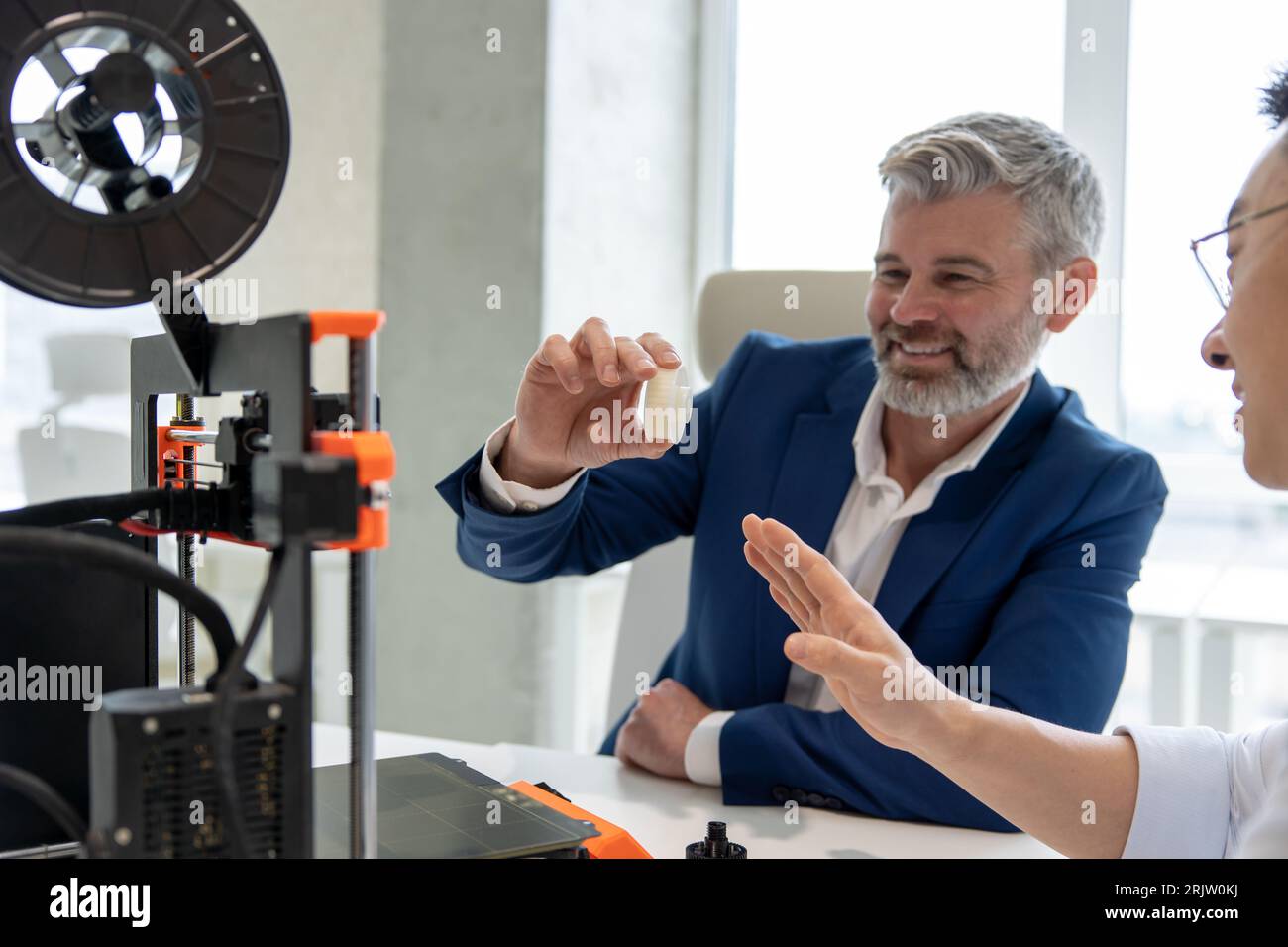 Innovative industrial engineers using 3D printer to build complex ...