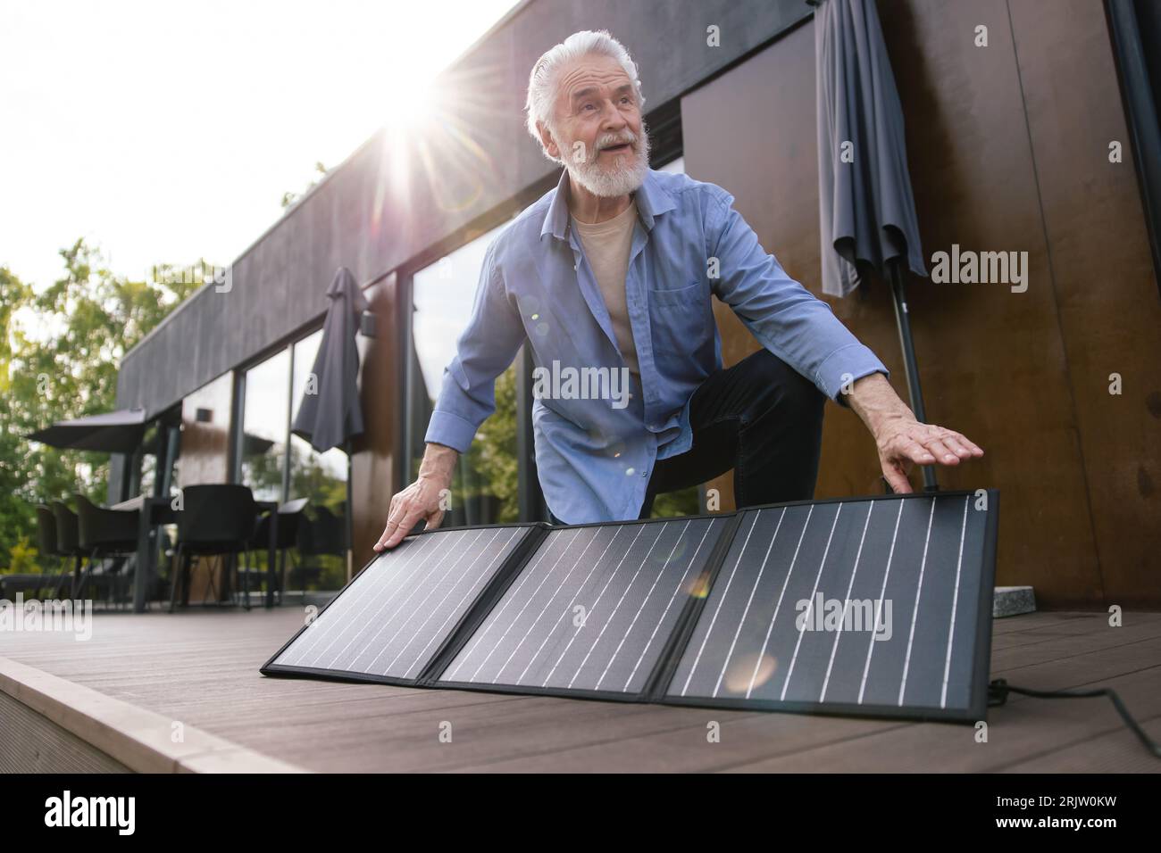 Mature man solar panel hi-res stock photography and images - Alamy
