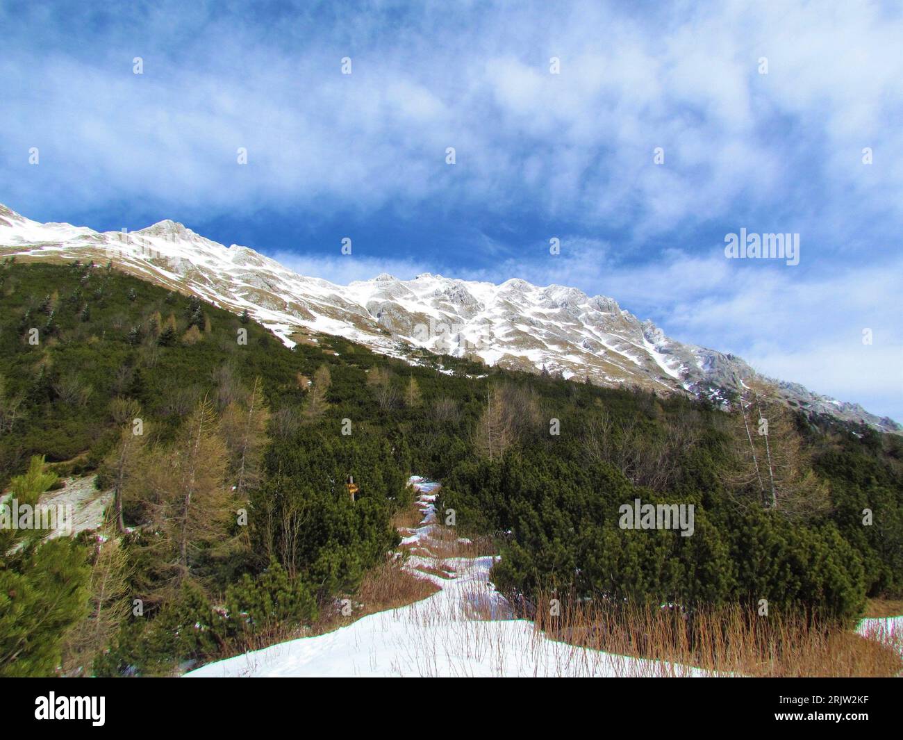 View of snow covered slopes under Vrtaca mountain in Karavanke ...