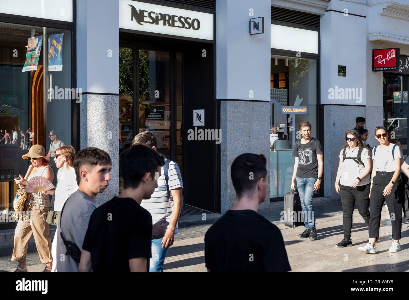 Pedestrians walk past the Swiss high-end and world leader in coffee ...