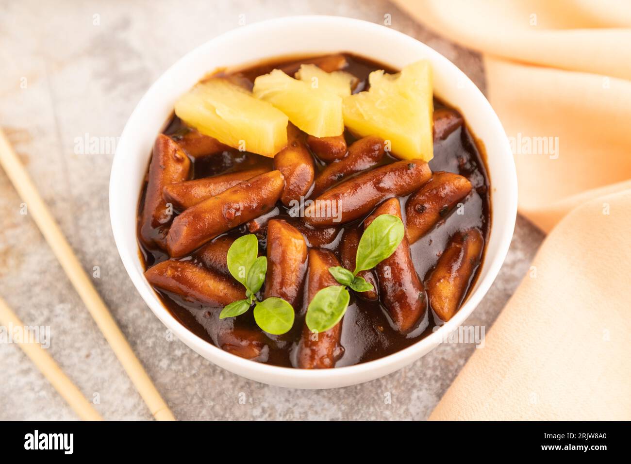 Tteokbokki or Topokki, fried rice cake stick, popular Korean street ...