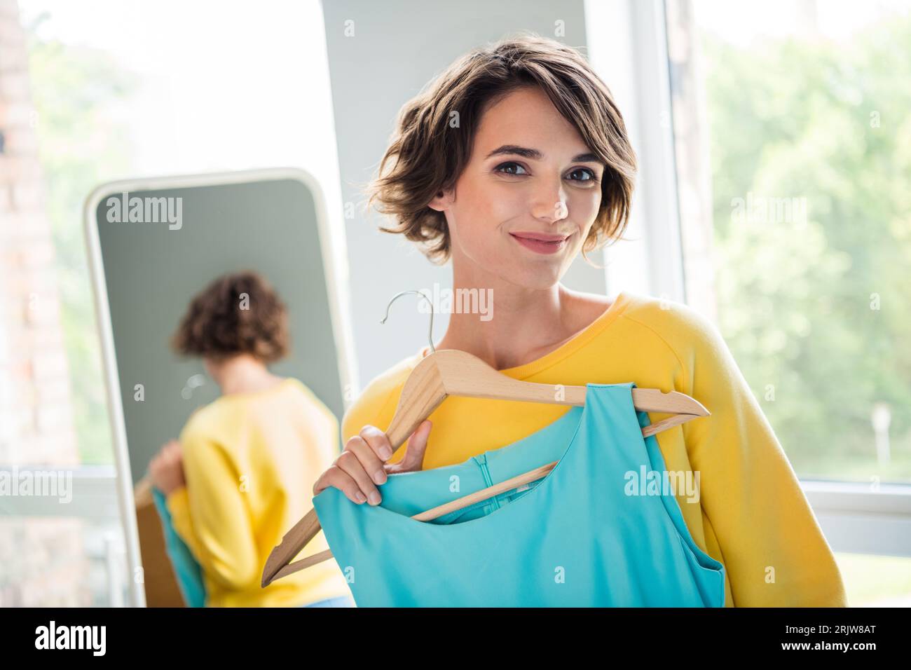 Photo of attractive pretty girl shopping assistant in store ready to ...