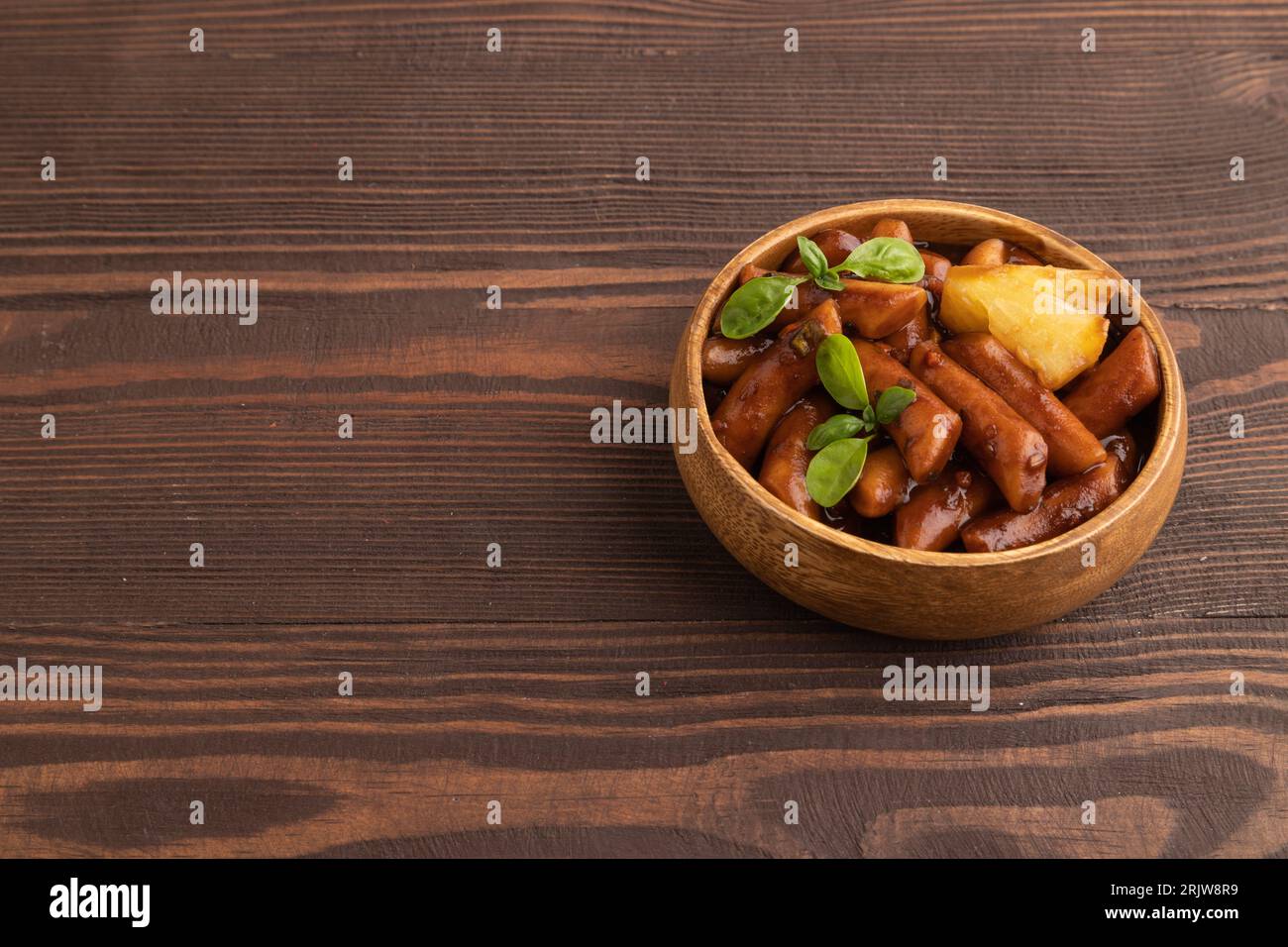 Tteokbokki or Topokki, fried rice cake stick, popular Korean street ...