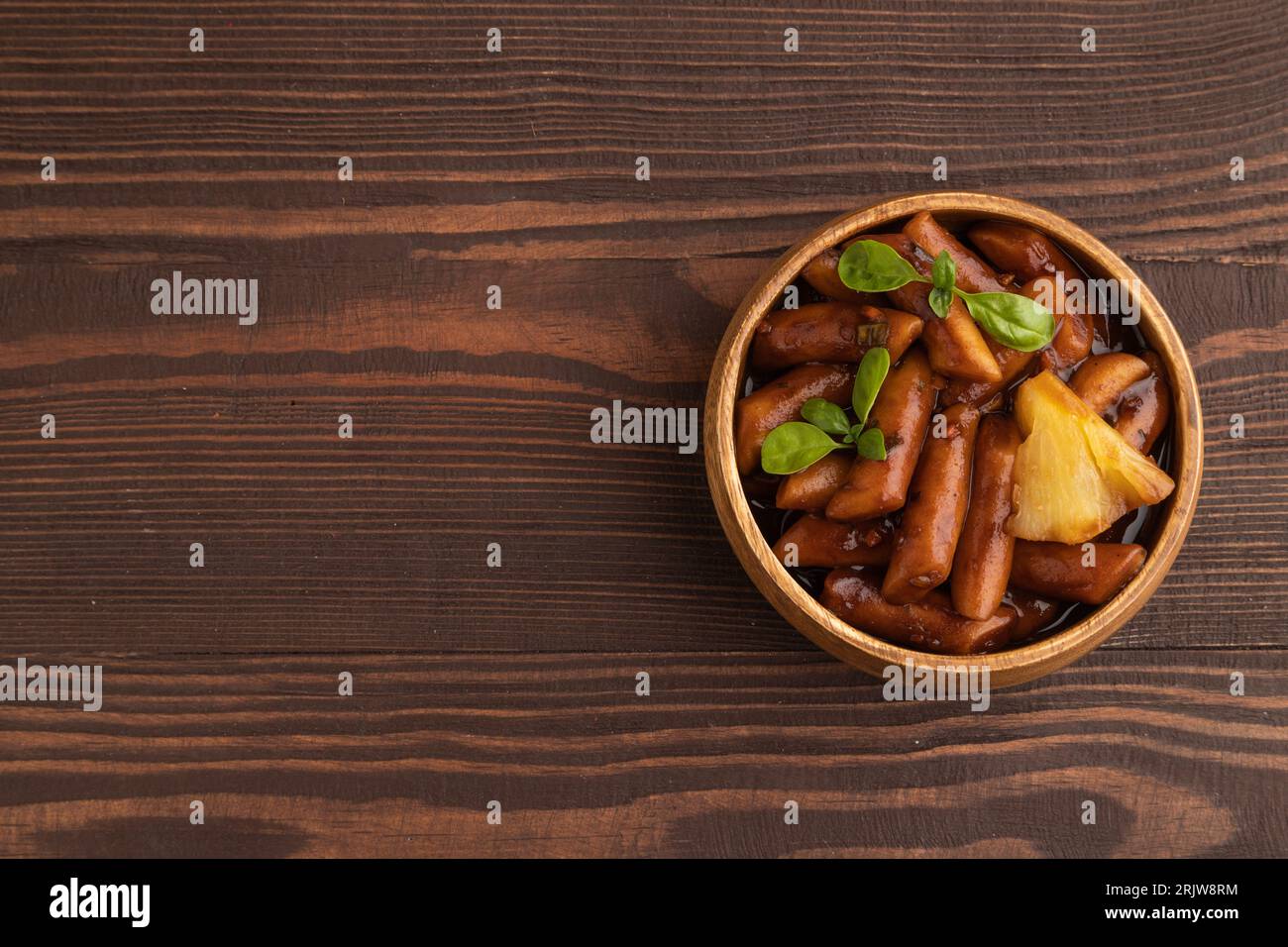 Tteokbokki or Topokki, fried rice cake stick, popular Korean street ...