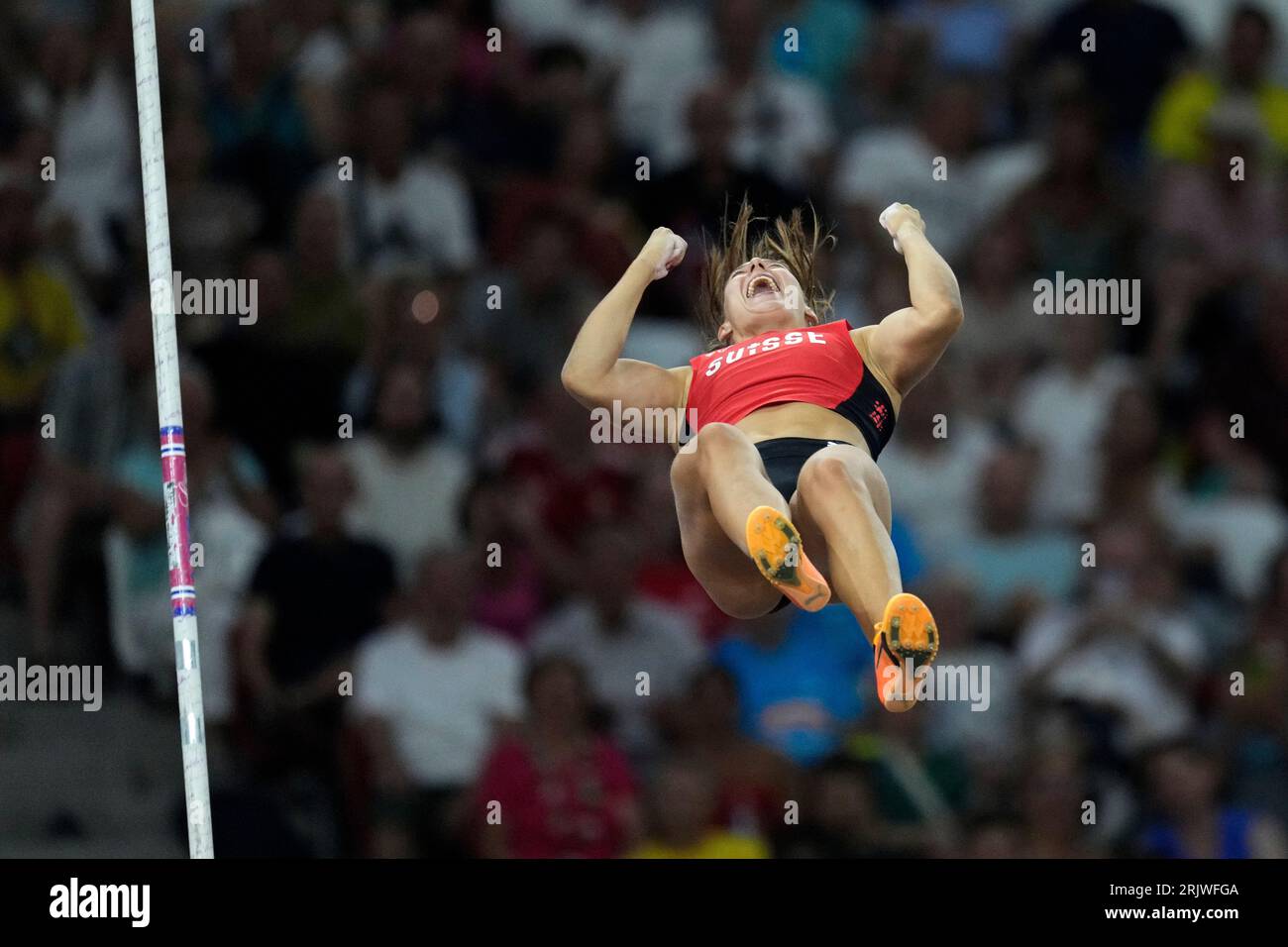 Angelica Moser, of Switzerland, reacts after clearing the bar in an ...
