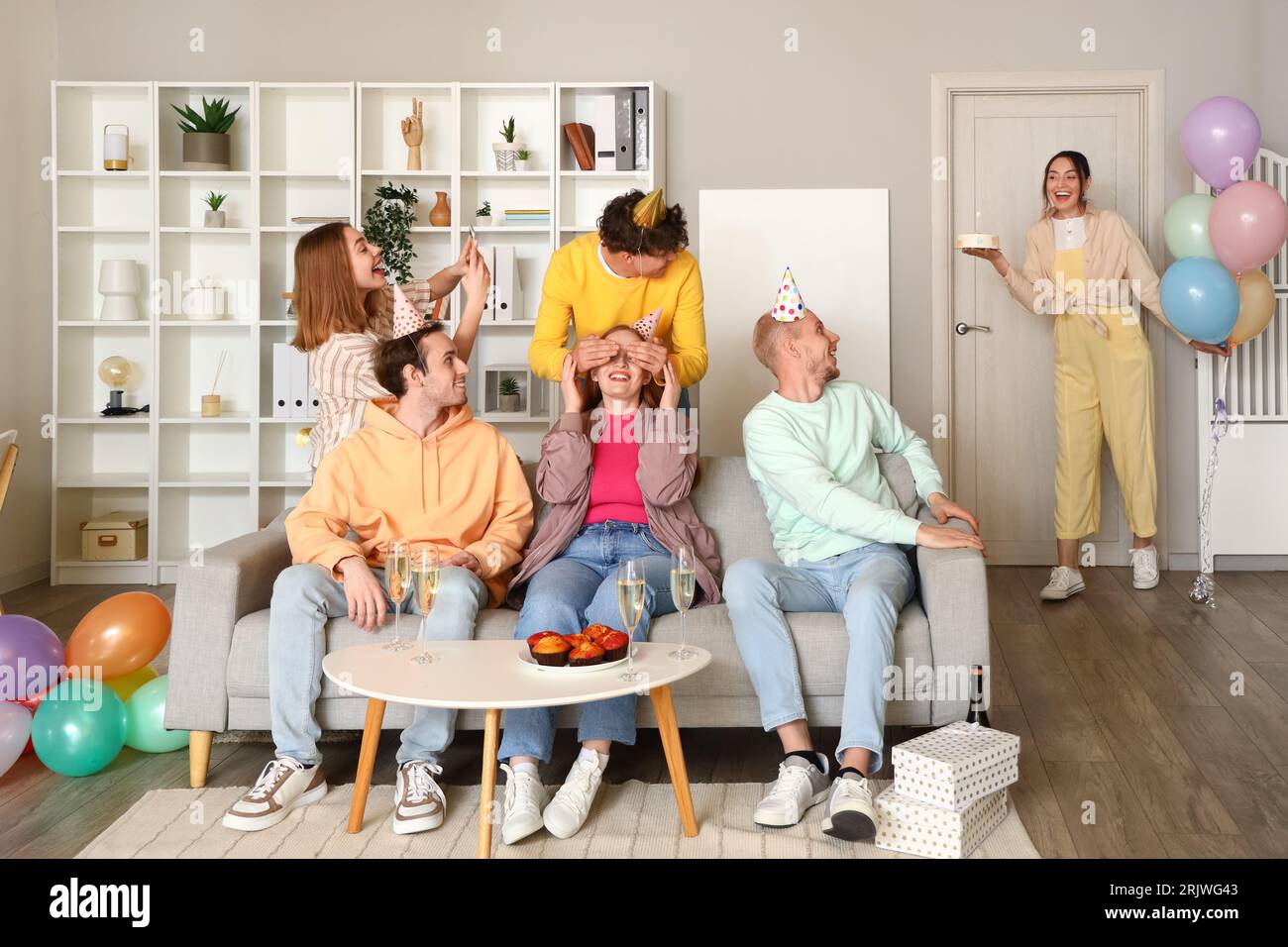 Young woman bringing Birthday cake to her friend at party Stock Photo ...