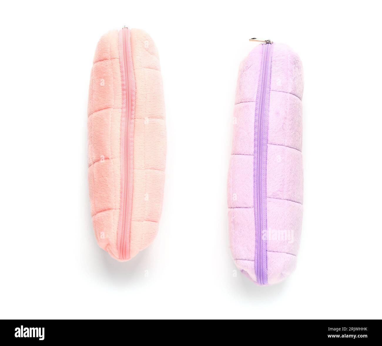Pink and purple pencil cases on white background Stock Photo - Alamy