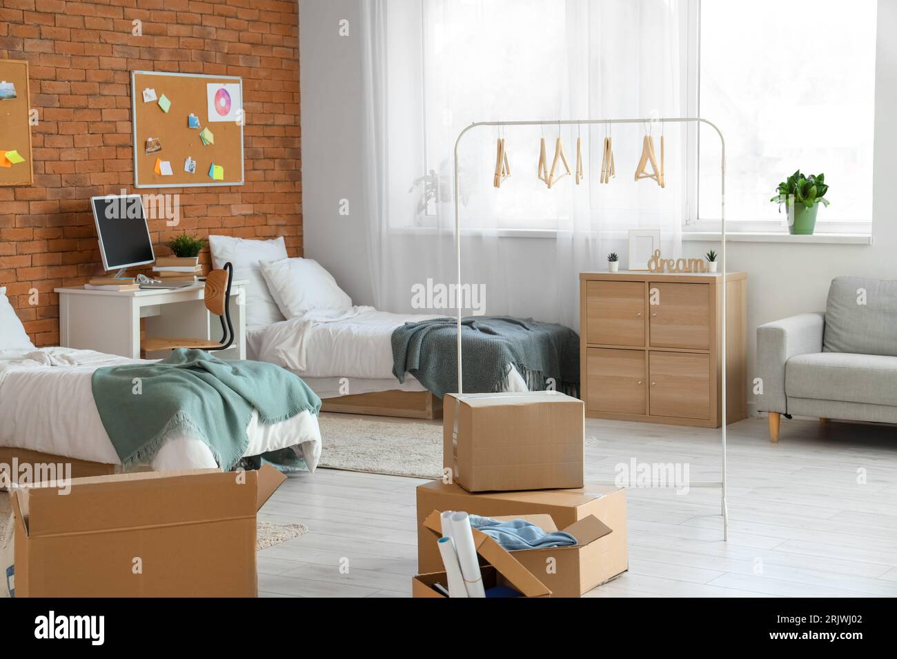 Cardboard boxes in dorm room on moving day Stock Photo - Alamy
