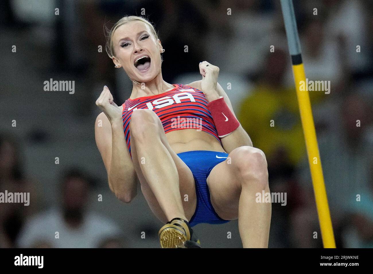 Katie Moon, of the United States, reacts after clearing the bar in an ...