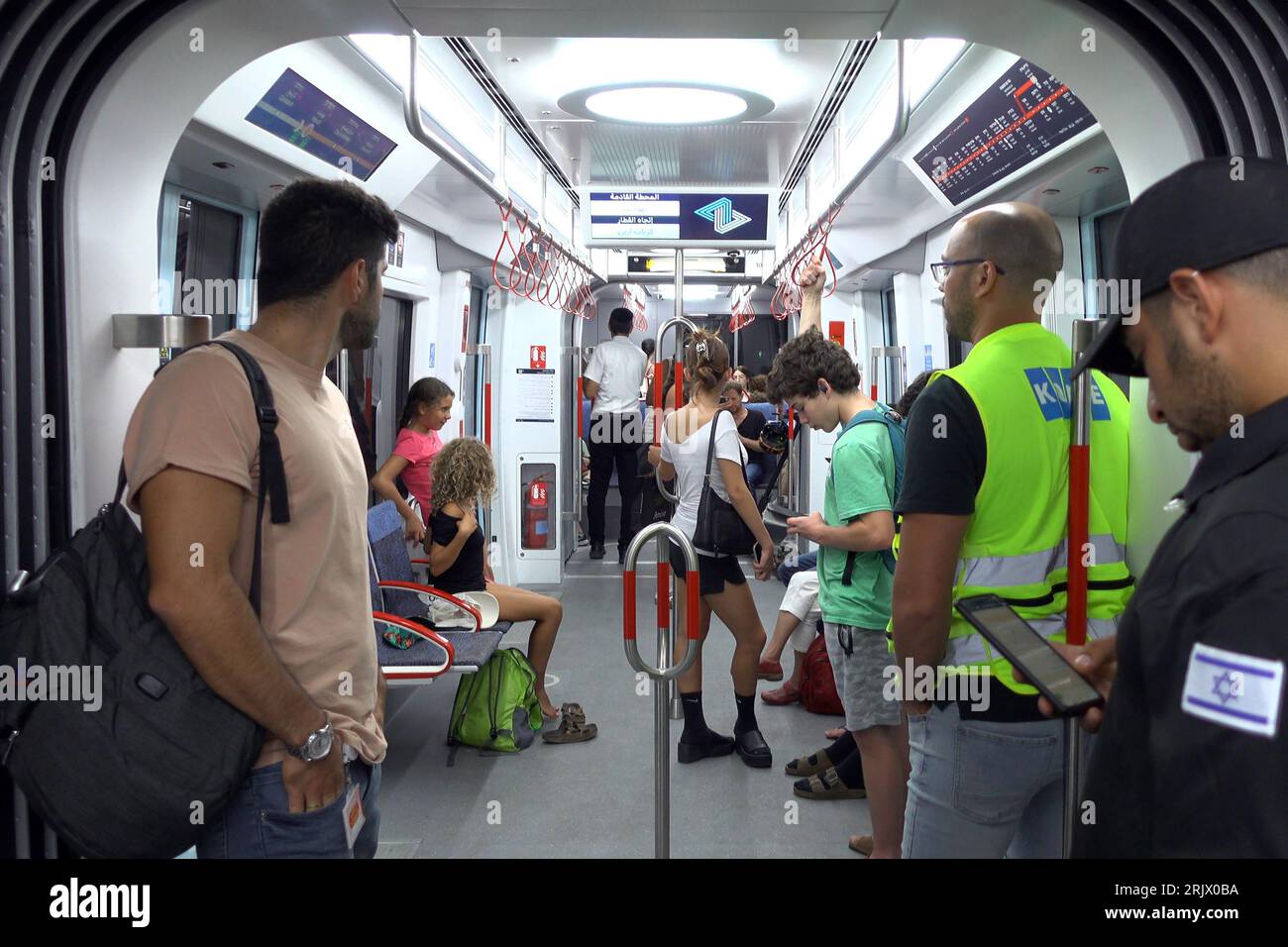 Passengers ride the train of the new metropolitan light rail system on ...