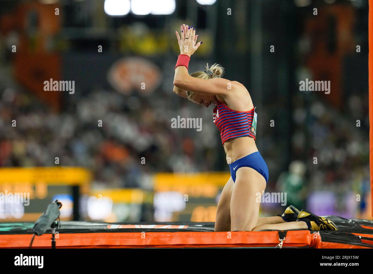 Katie Moon, of the United States, reacts after her vault in the women's ...