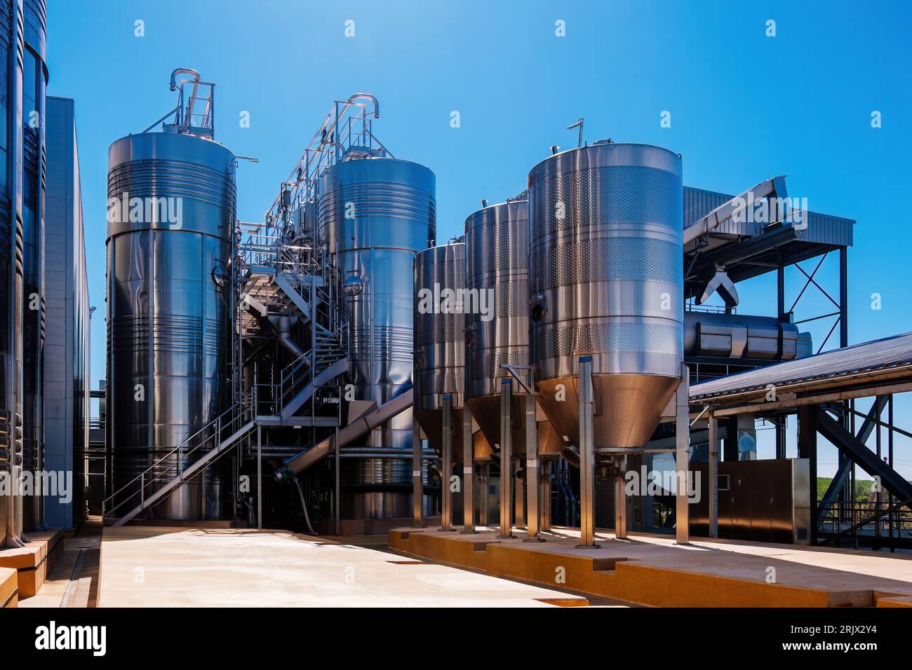 Modern winery outdoors. Stainless steel vats for wine fermentation ...