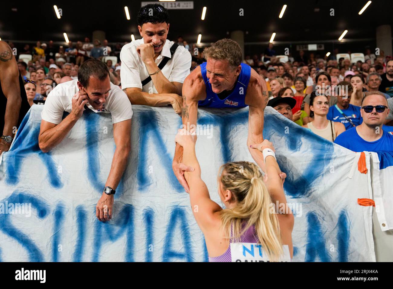 Molly Caudery, of Great Britain, greets people in the stands after ...