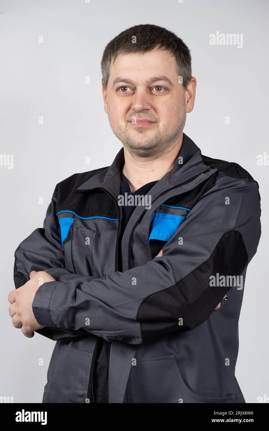 Portrait of a man in working overalls on a white background Stock Photo ...