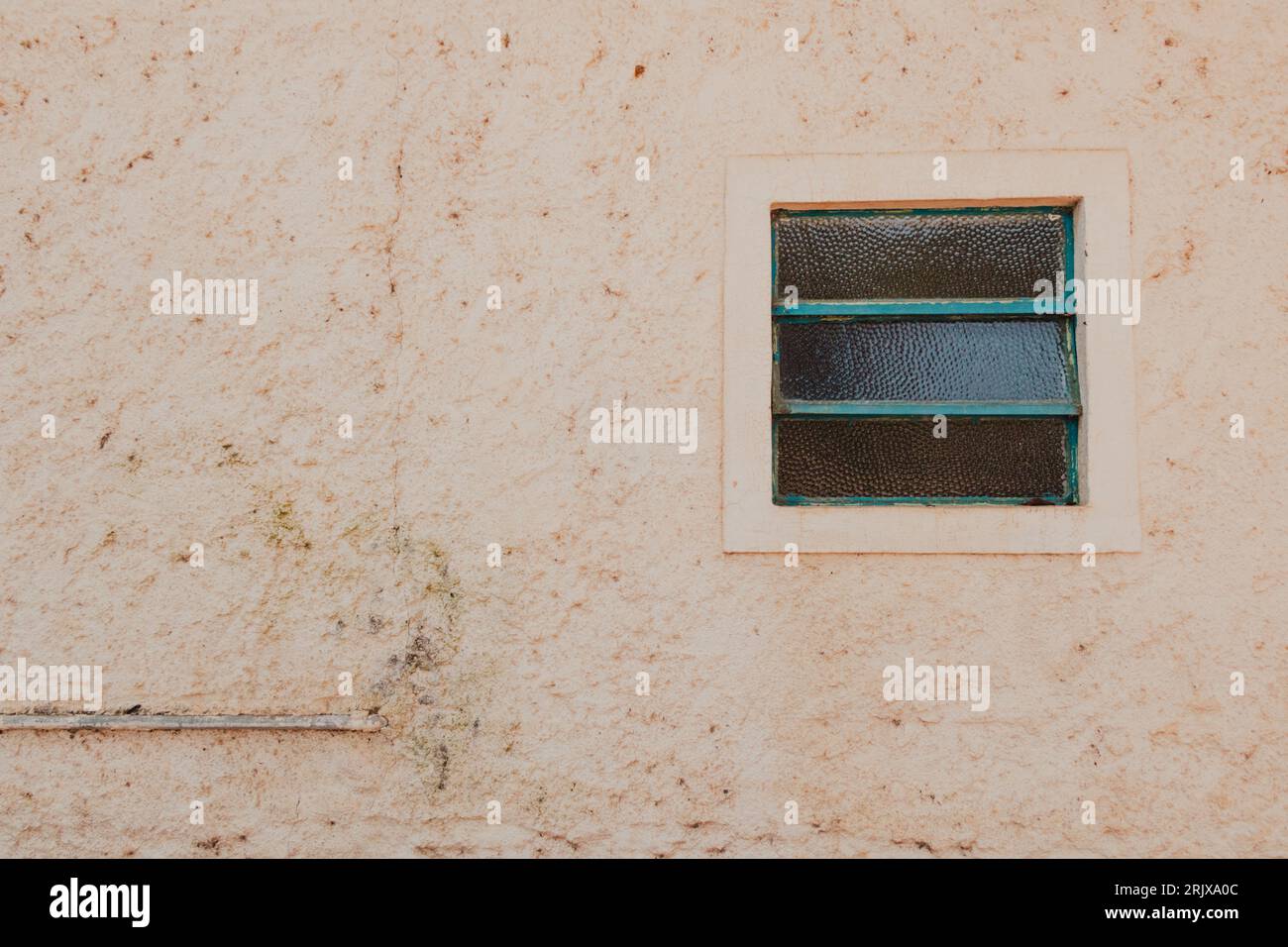 textured wall background with single window Stock Photo - Alamy