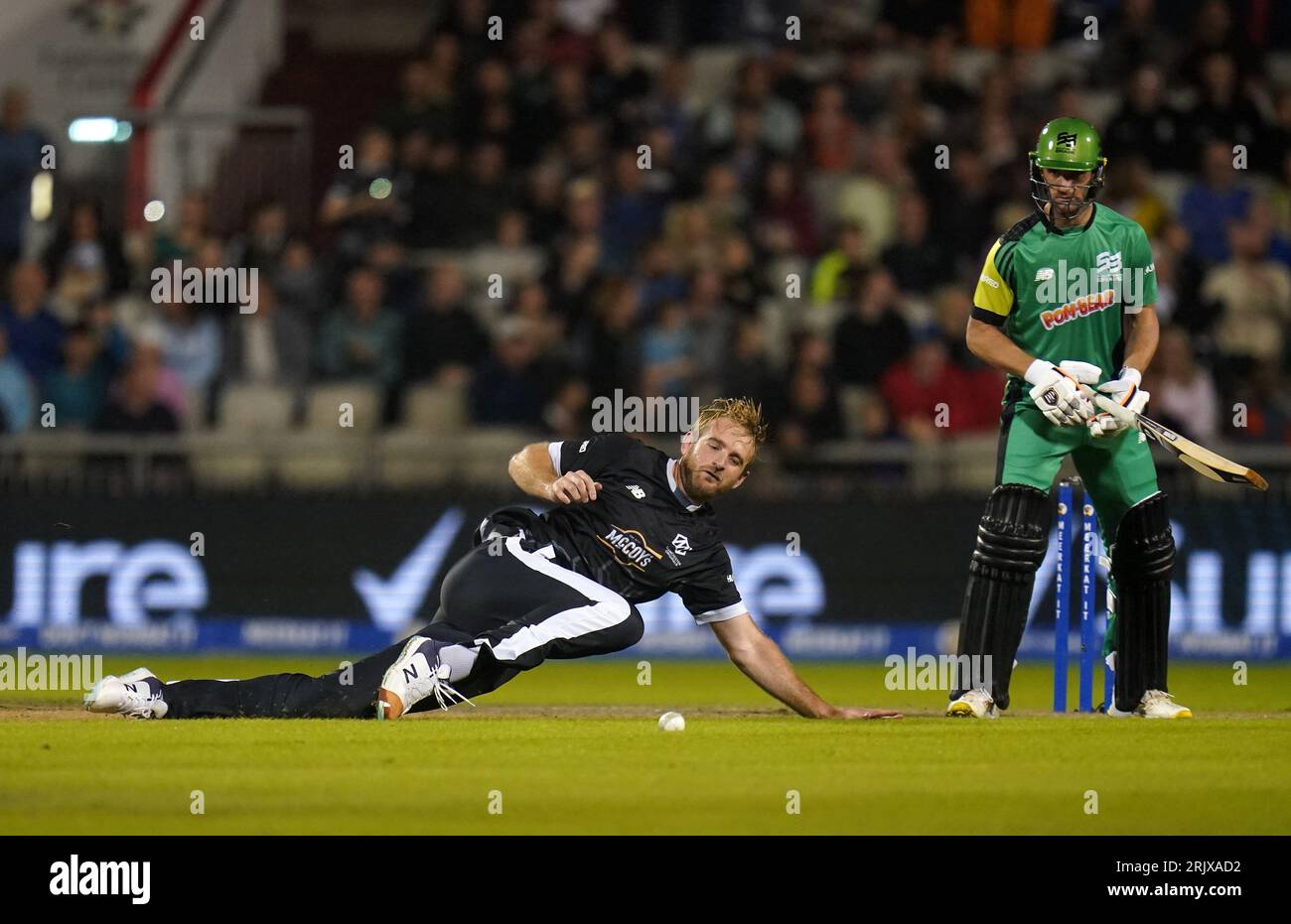 Manchester Originals' Paul Walter (left) attempts to claim the ball as ...