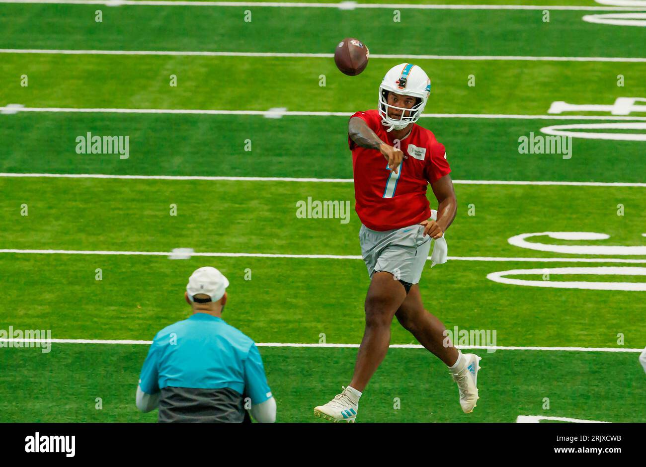 Miami Dolphins quarterback Tua Tagovailoa (1) throws a pass during NFL football training camp at ...
