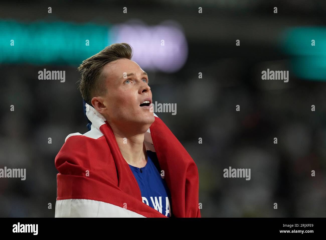 Karsten Warholm, of Norway, reacts after winning the men's 400-meters ...