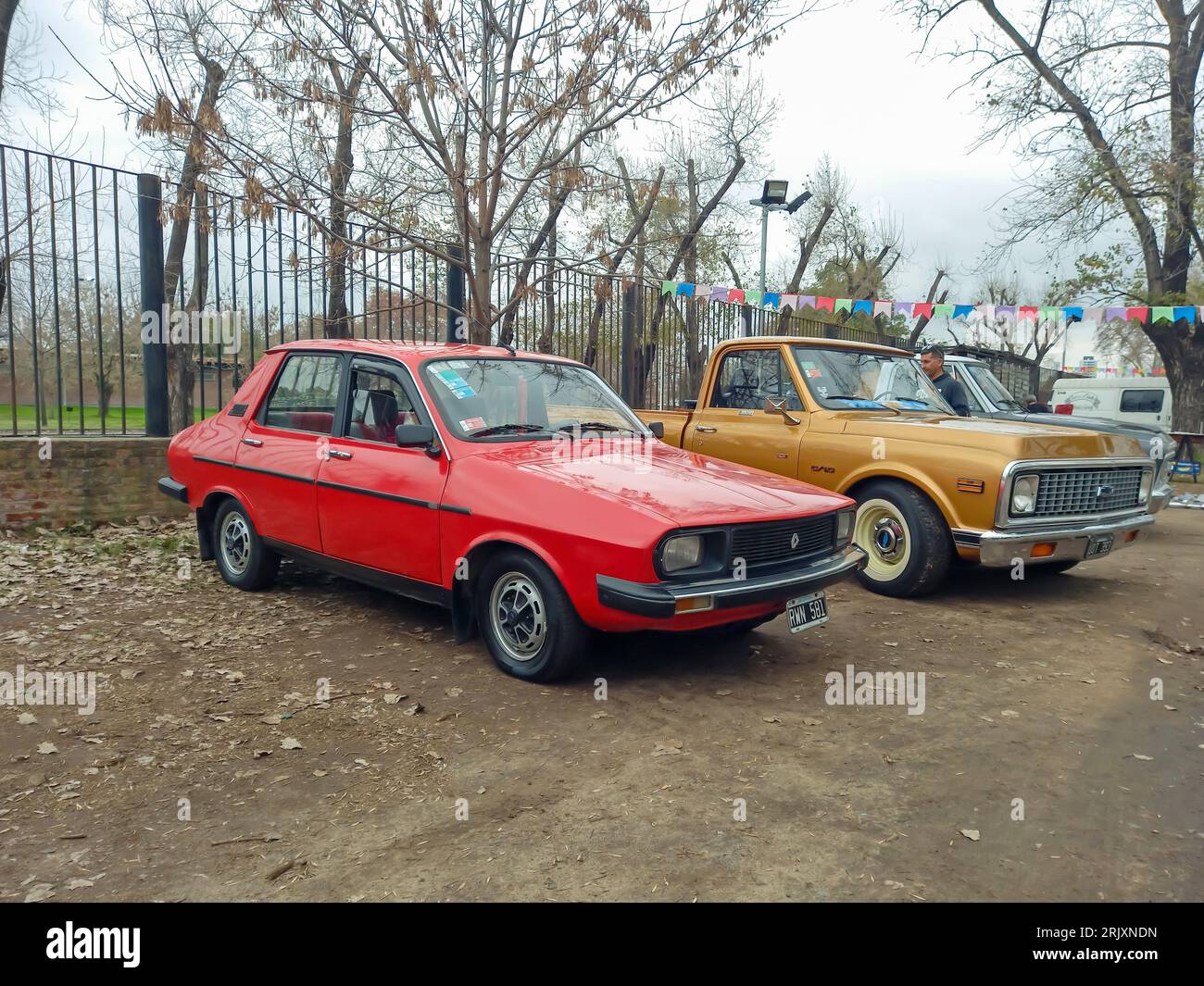 Old red 1980s Renault 12 Sedan in a park in autumn. Classic car show ...