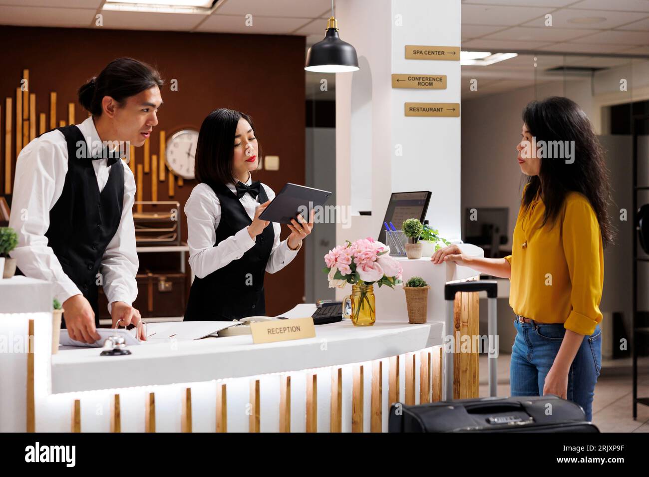 Business man welcomed by women hi-res stock photography and images - Alamy