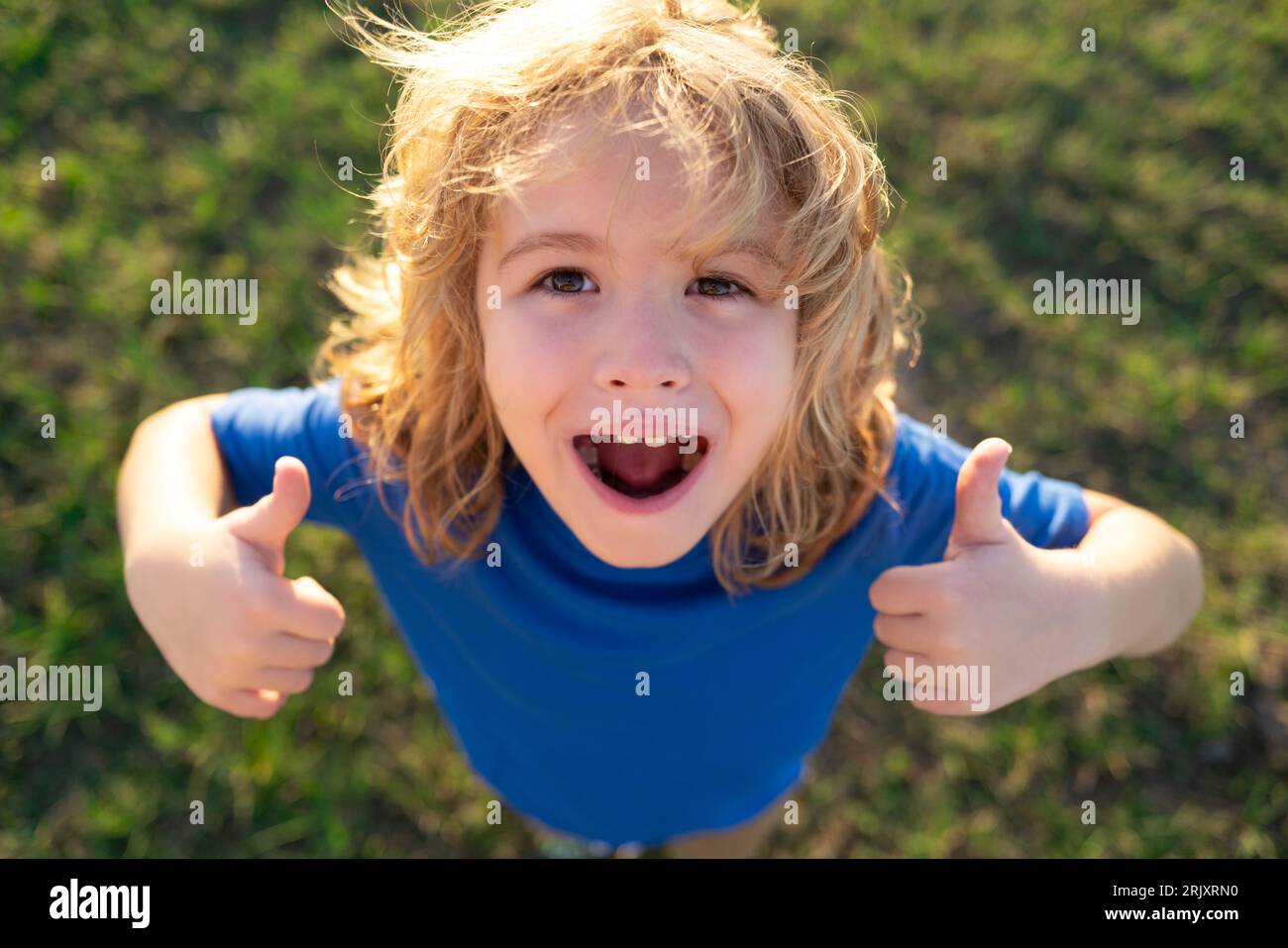 Outdoor closeup portrait of funny kids face. Summer kid outdoor ...