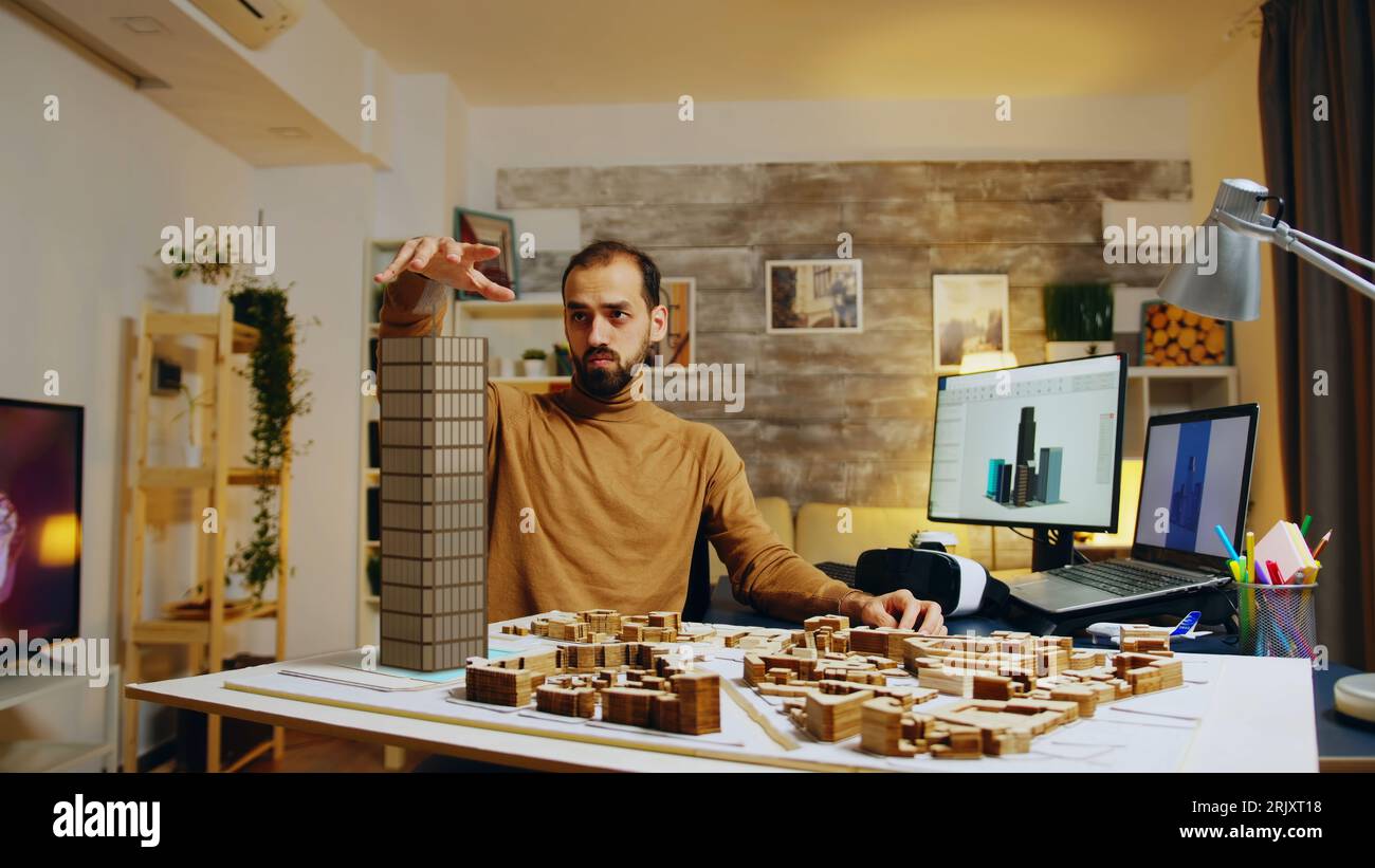 Architect working in office on creation of new residential complex ...