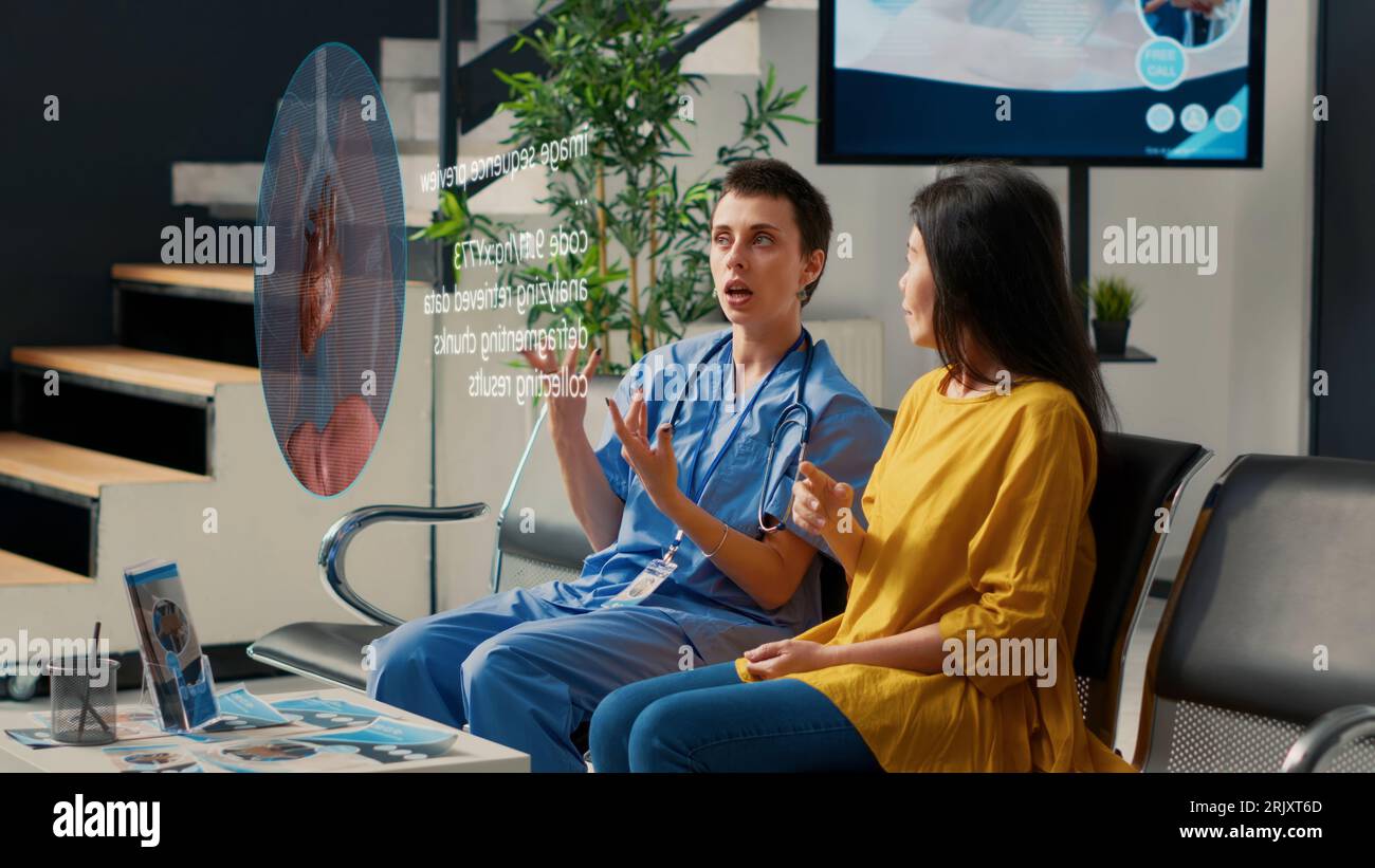 Cardiologist in modern clinic lounge using holographic projector ...
