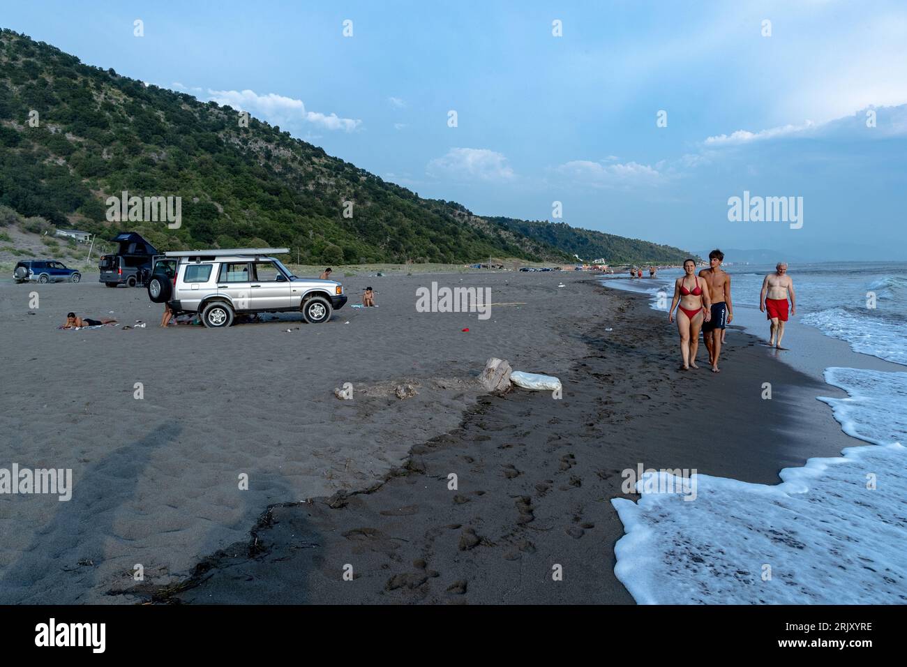 People are walking along the captivating "Rana e Hedhun" Beach where ...