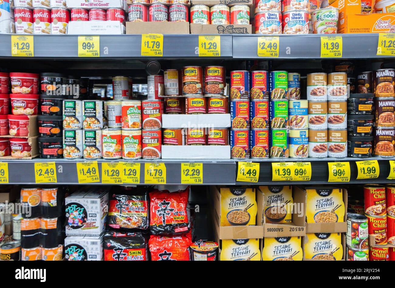 Supermarket aisle with a variety of canned foods and packaged goods ...