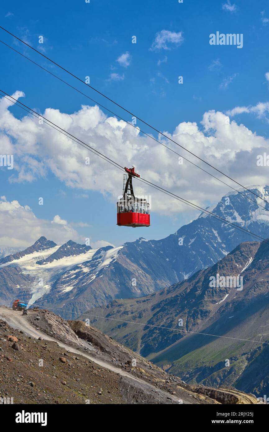 old red cable car on the background of mountains Stock Photo - Alamy