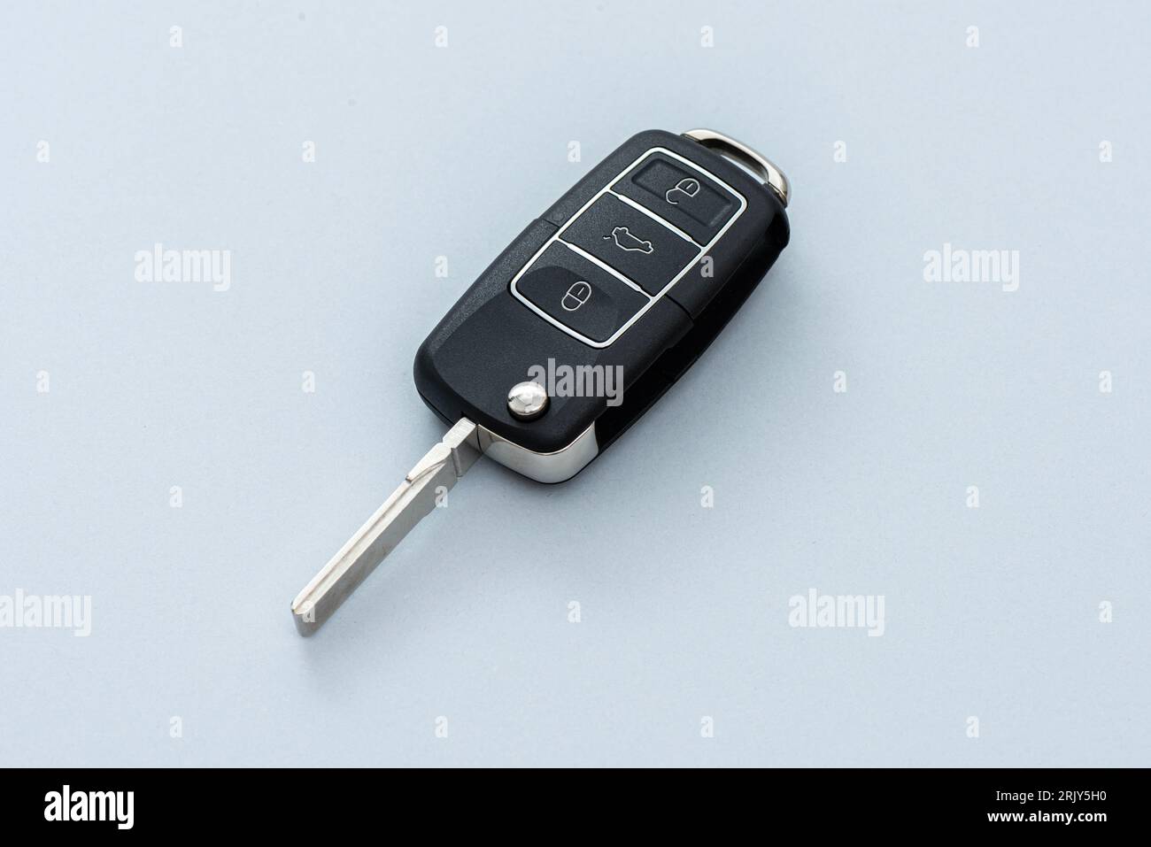 Wireless car key on the blue background Stock Photo - Alamy