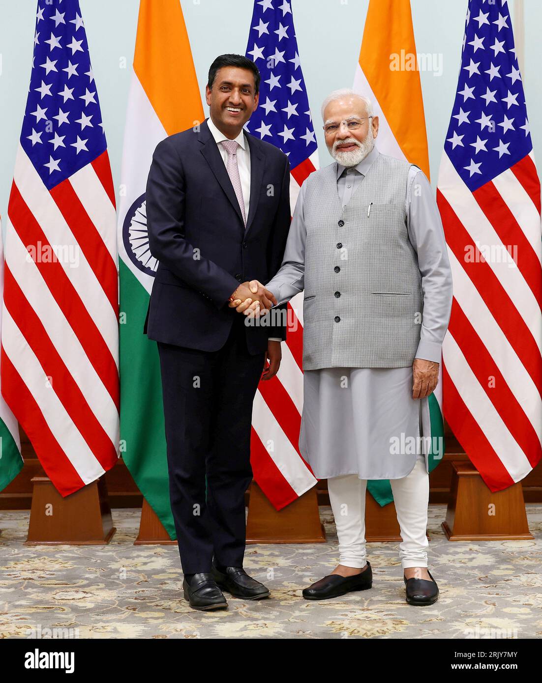 New Delhi, India. 16 August, 2023. Indian Prime Minister Narendra Modi, right, shakes hands with ...