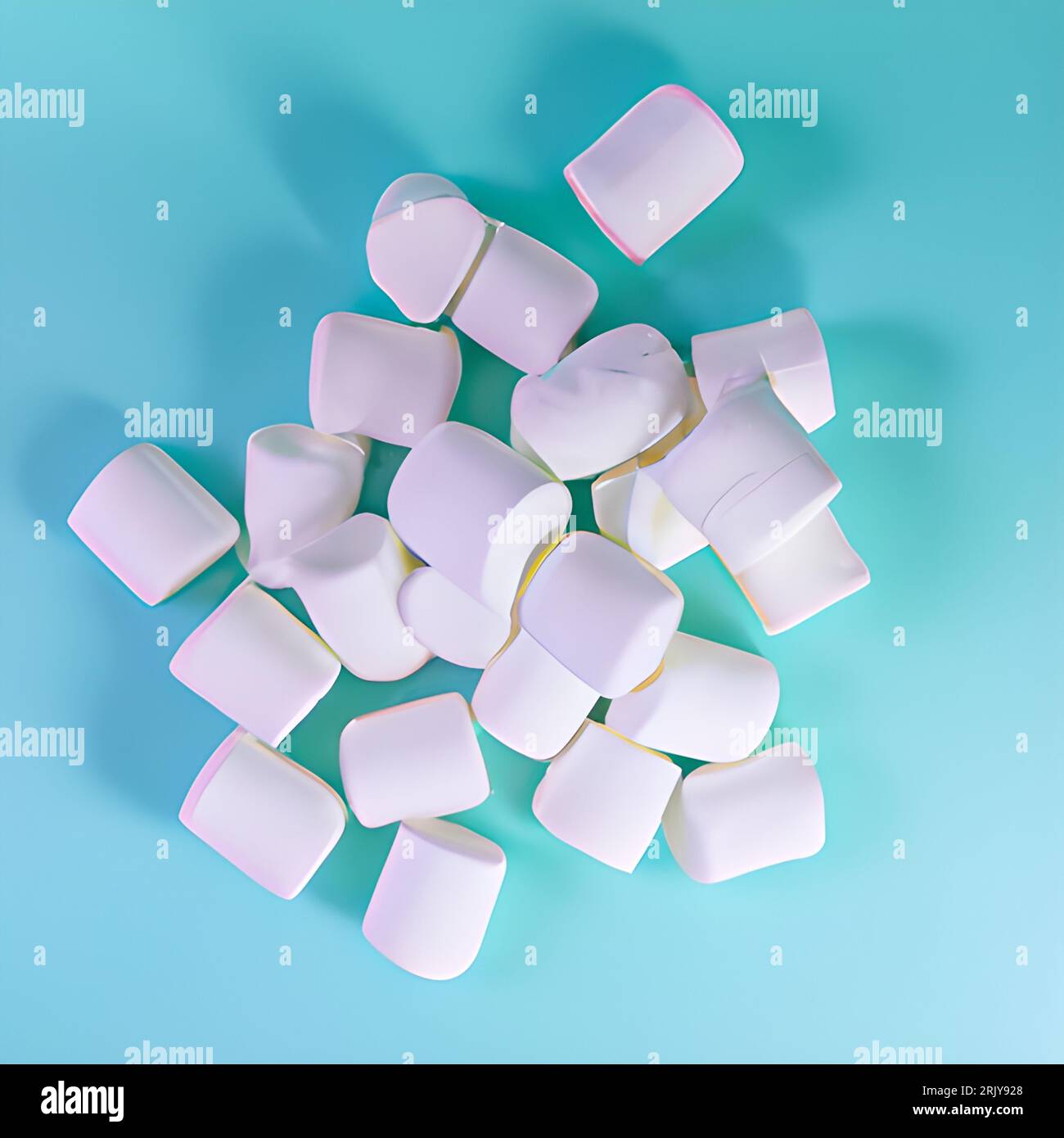 An overhead view of white marshmallows against a light blue background ...