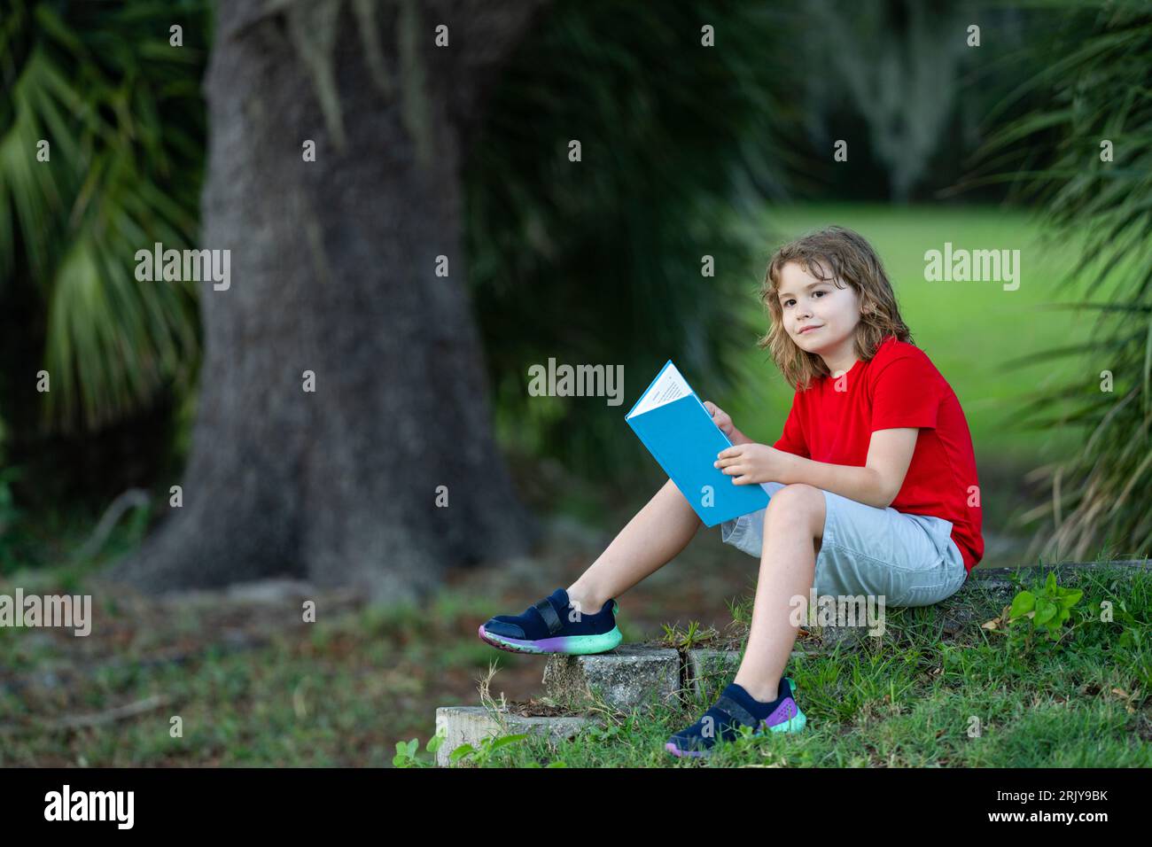 Kid read a book. Early education for kids. Summer vacation with reading ...