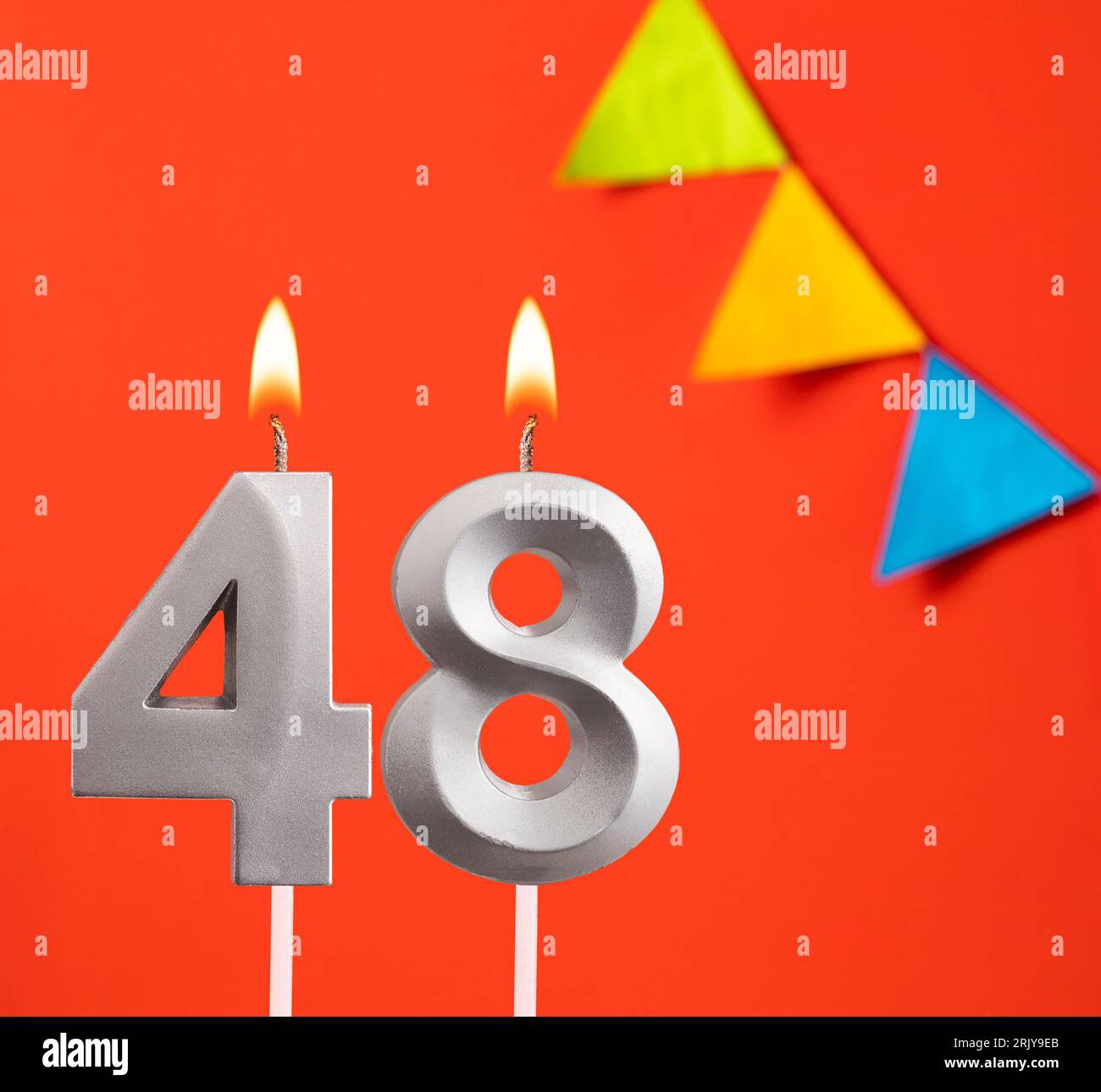 Birthday card - Number 48 candle in orange background Stock Photo - Alamy