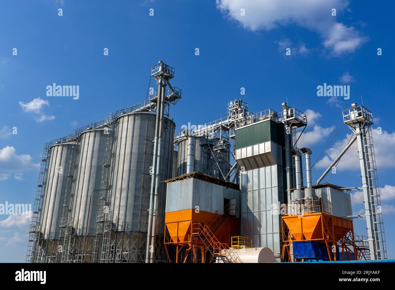 Modern Granary elevator and seed cleaning line. Silver silos on agro ...