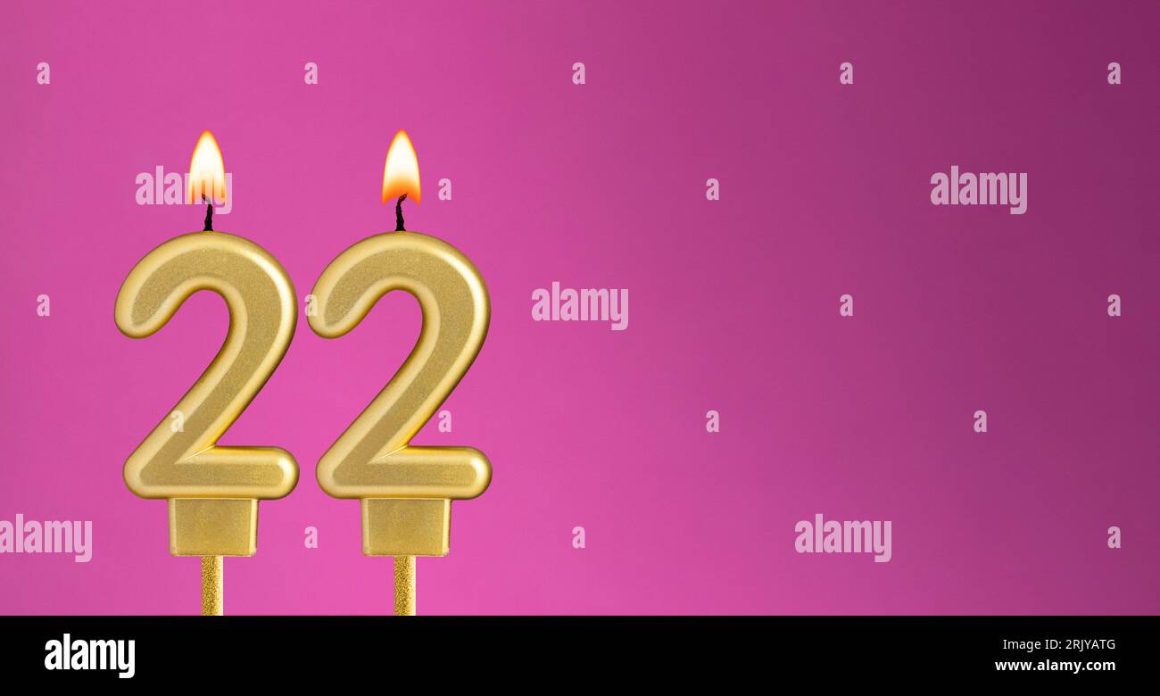 Birthday card with candle number 22 - purple background Stock Photo - Alamy