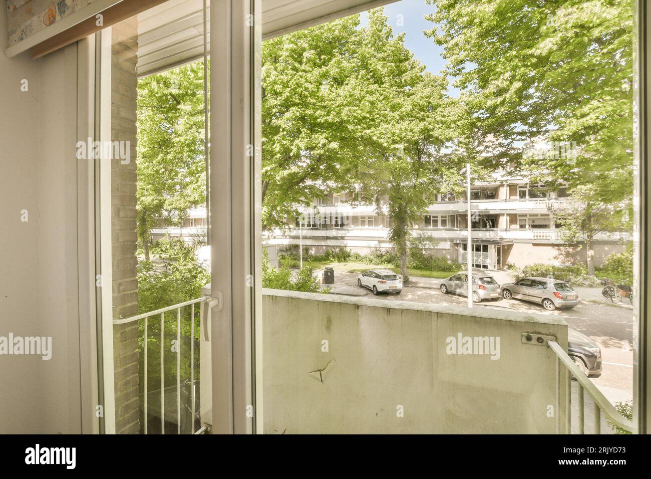 an outside area with trees and buildings in the background, taken from ...
