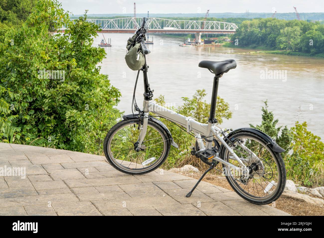 lightweight folding bike on a high shore of the Missouri River above ...